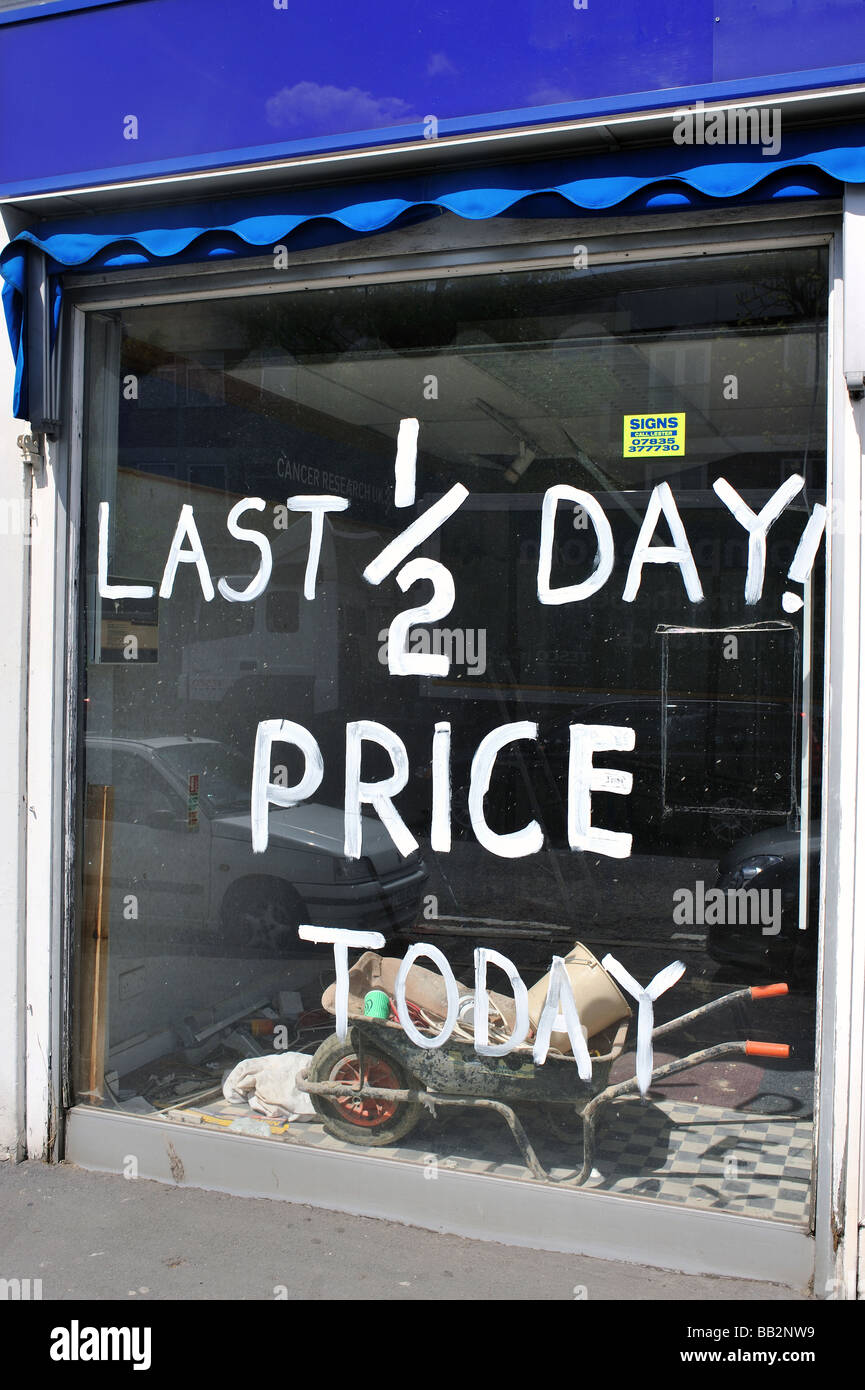 A Shop in Banstead High Street with a last day half price today sign ...