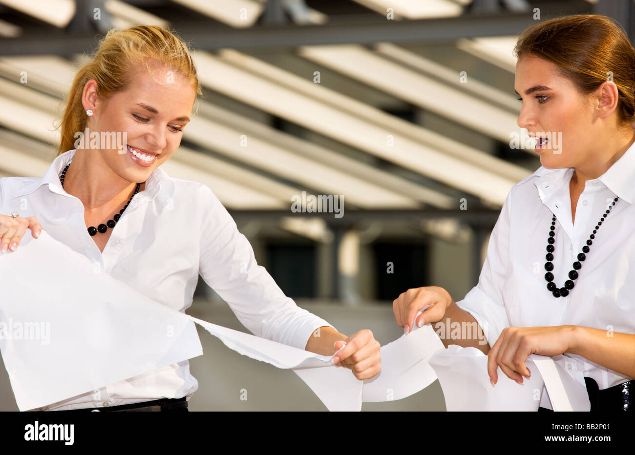 bright picture of two angry businesswomen fighting Stock Photo - Alamy