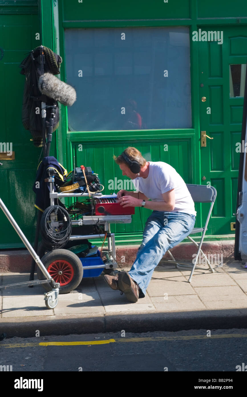 London Southbank film crew sound man with headphones and microphones ...