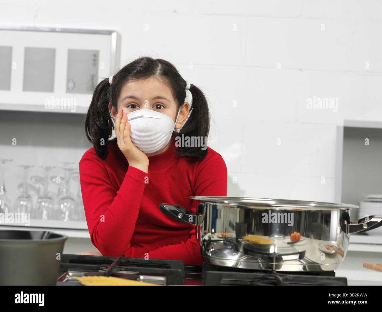 little girl in the kitchen with mask Stock Photo - Alamy