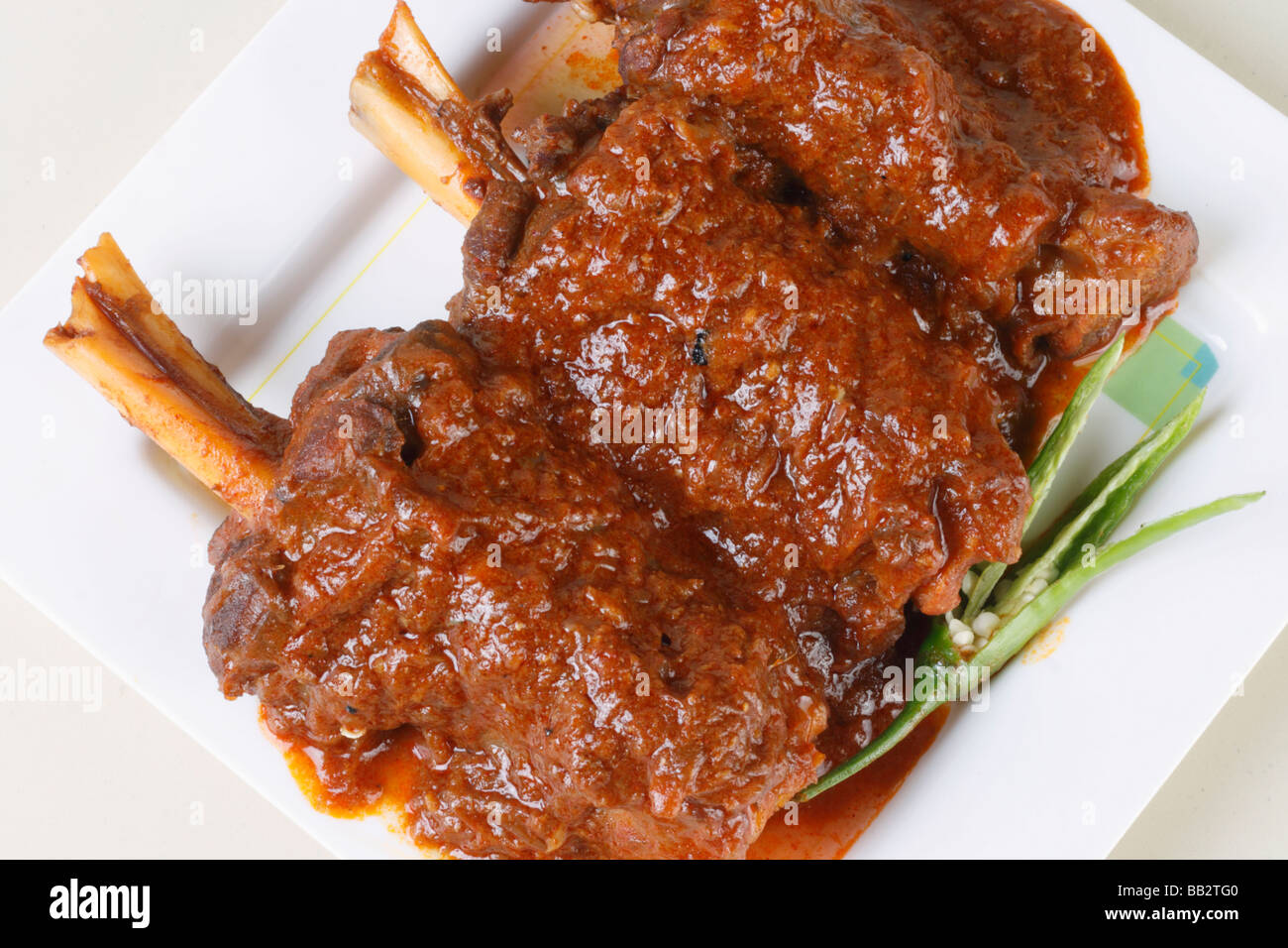 Mutton marinated in spicy yogurt and cooked in a red gravy Stock Photo ...