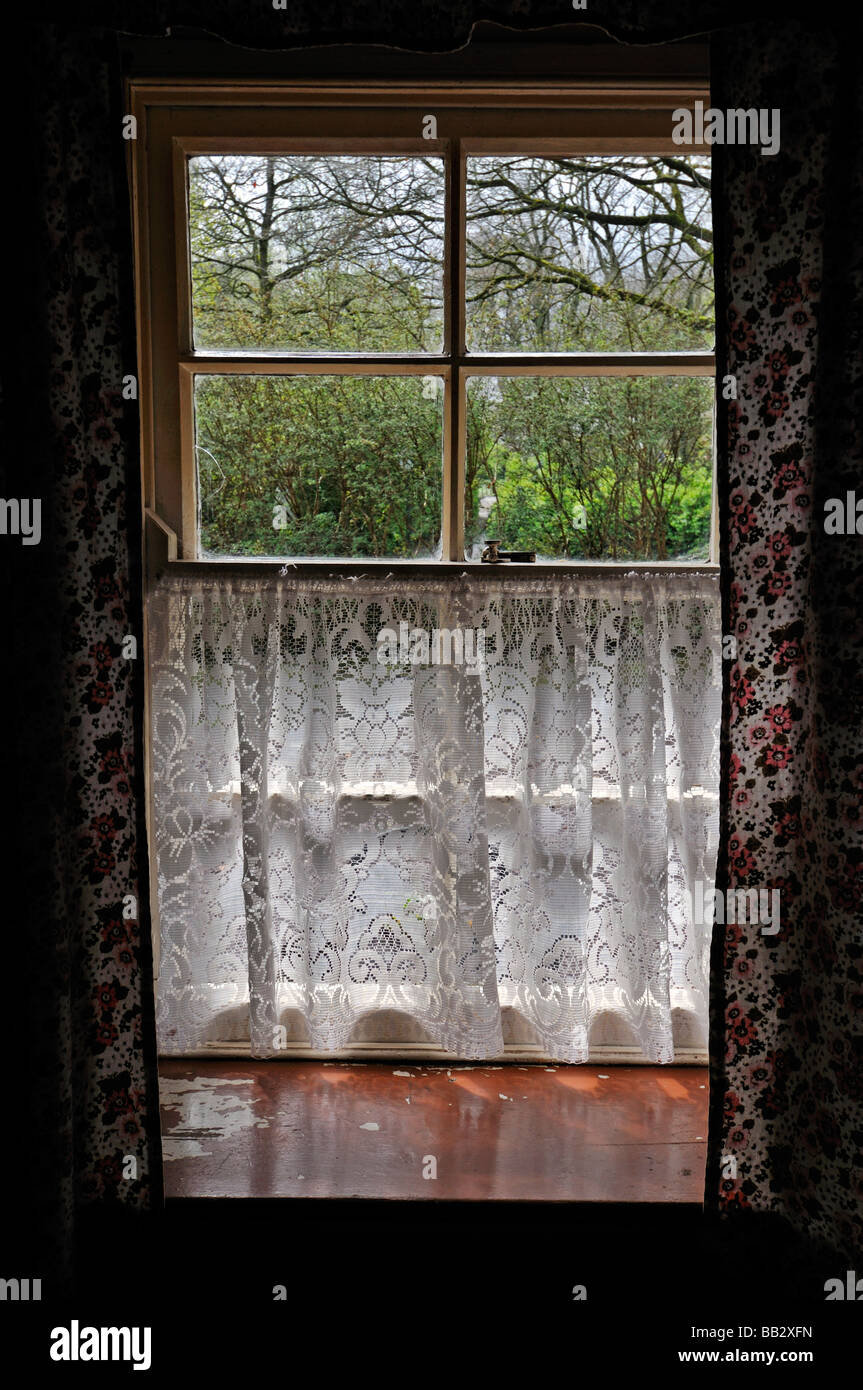 looking out view outside outwards through net curtain old farmhouse ...
