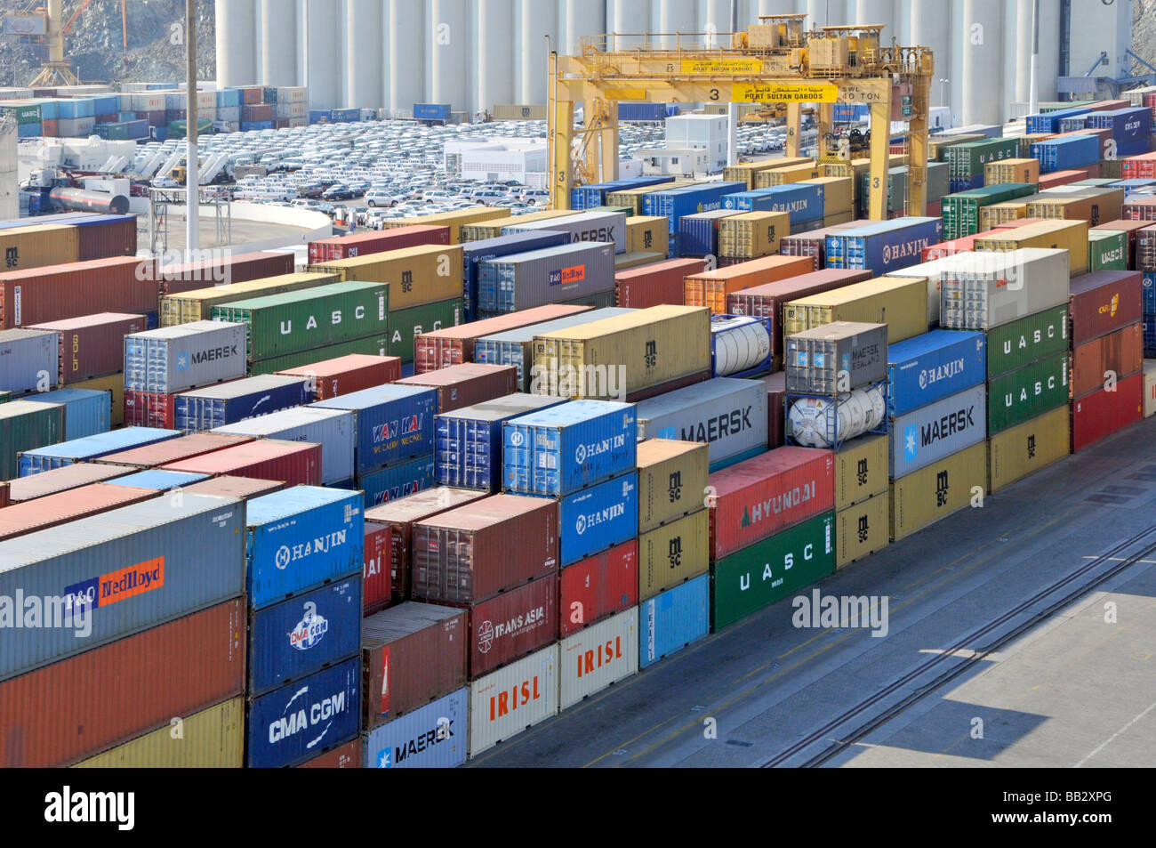 Aerial view commercial dock & colourful shipping containers below ...