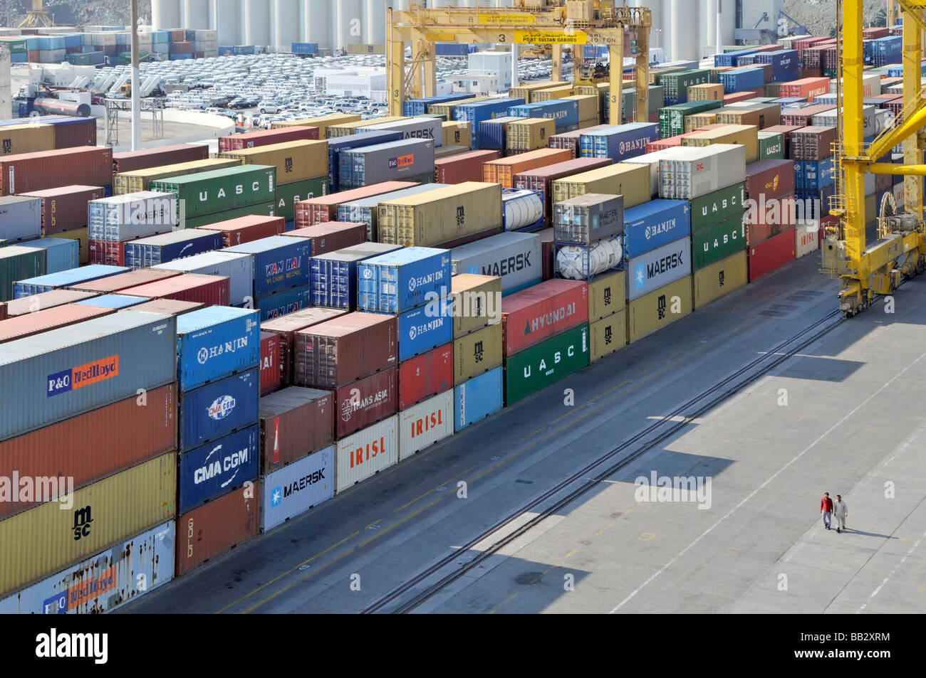 Aerial view commercial dock & colourful shipping containers below ...