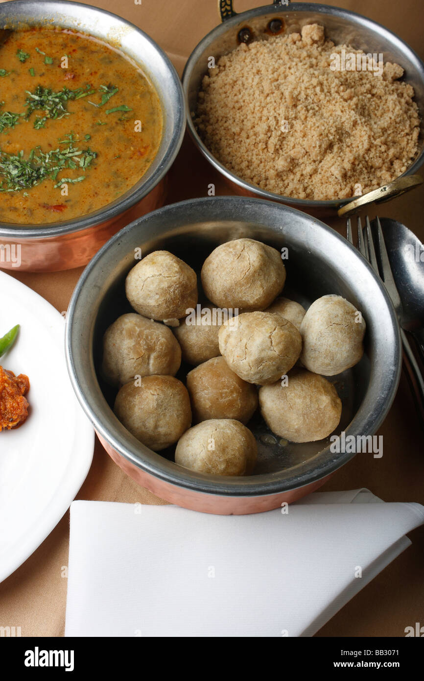 Daal Bati is a typical Rajasthani veg dish in which puffed dough ...