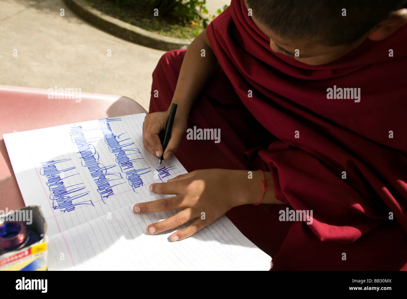 Young monk practicing calligraphy, Dharamsala, India Stock Photo - Alamy