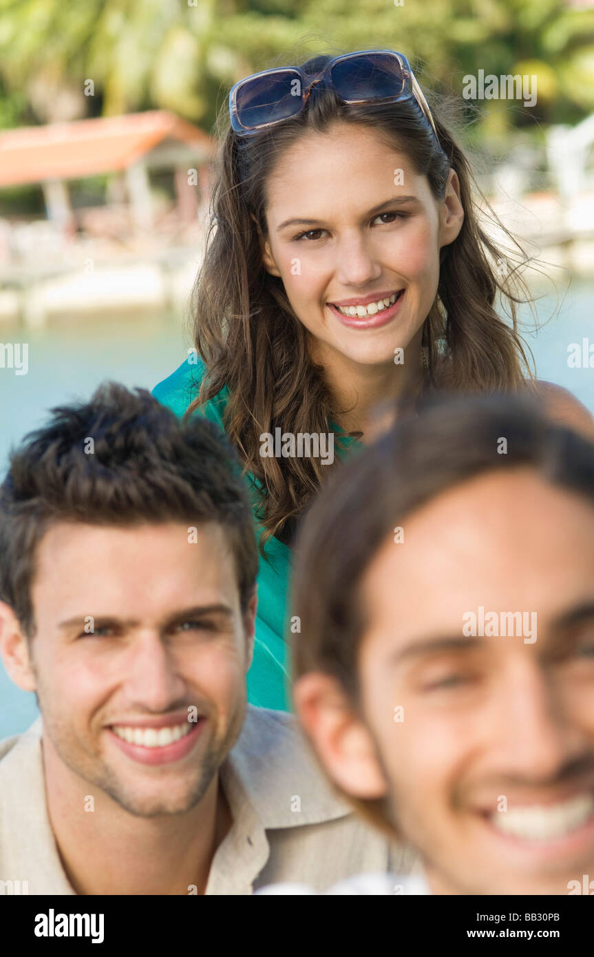 Three friends smiling Stock Photo - Alamy