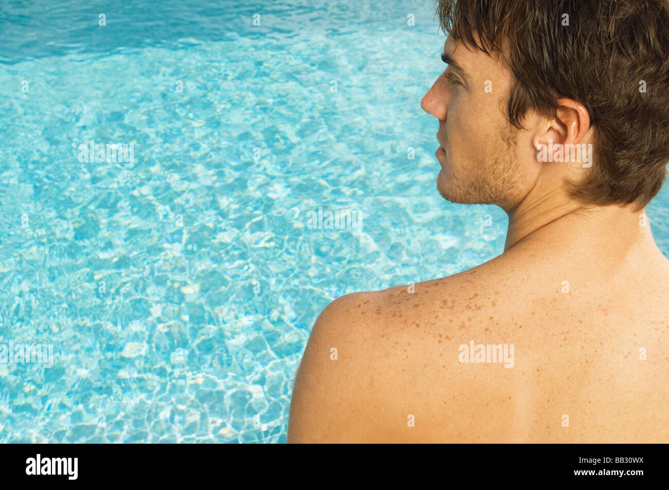 Close-up of a man at the poolside Stock Photo - Alamy