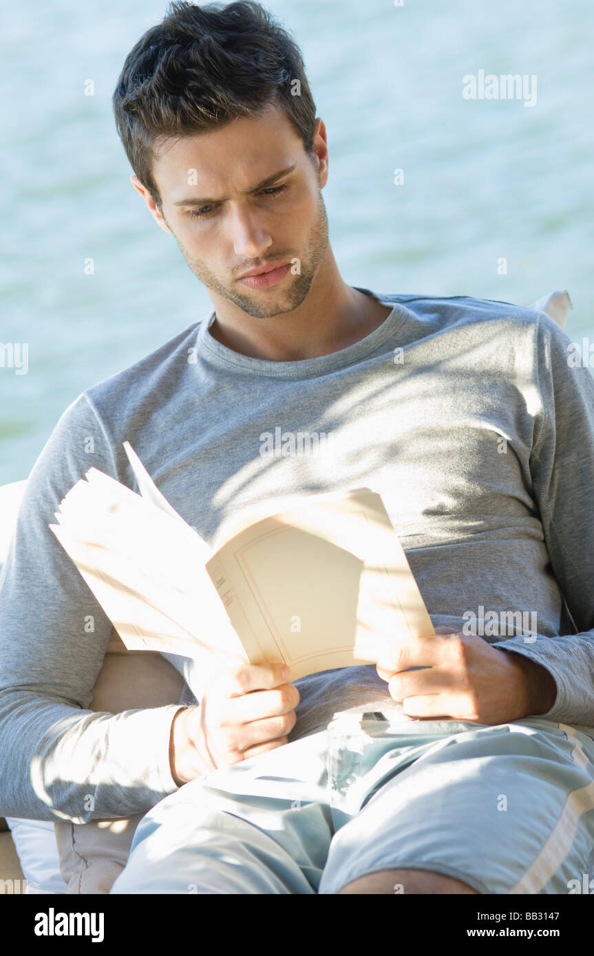 Man reading a book Stock Photo - Alamy