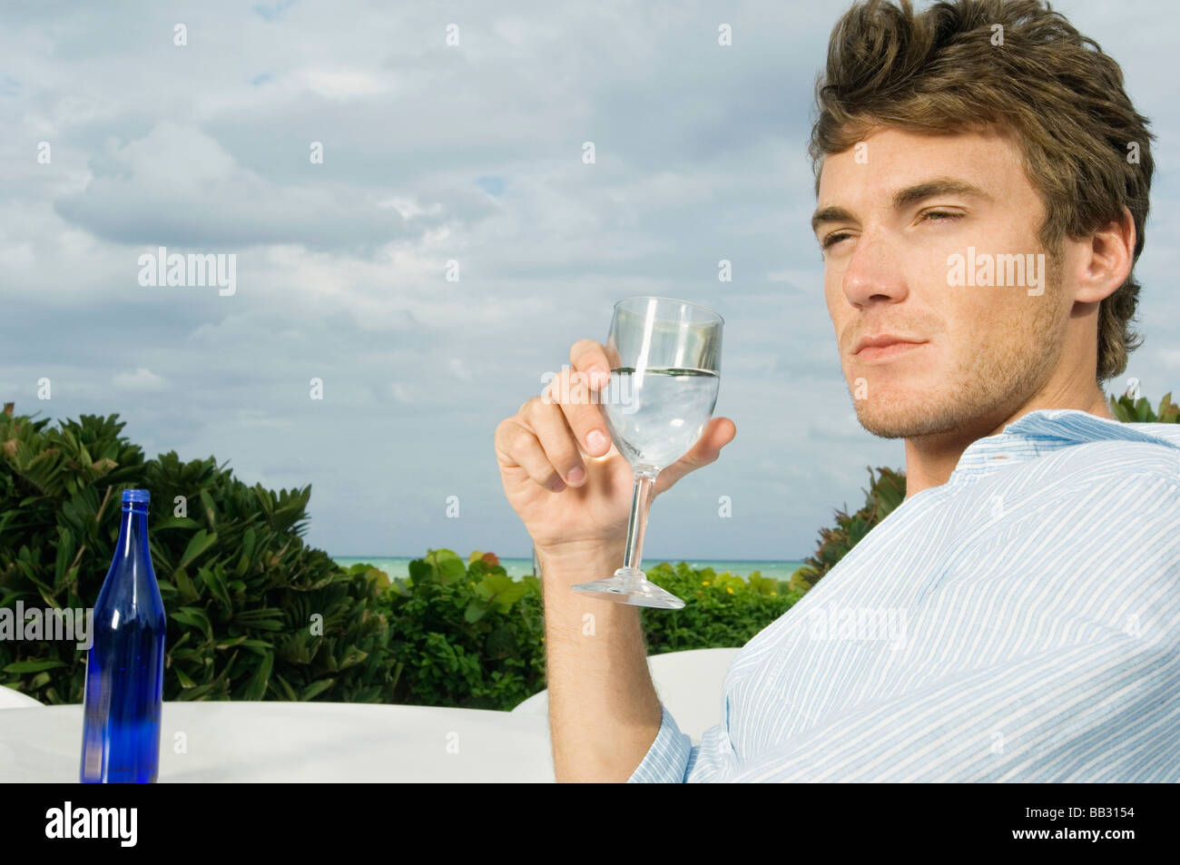 Close-up of a man drinking water Stock Photo - Alamy