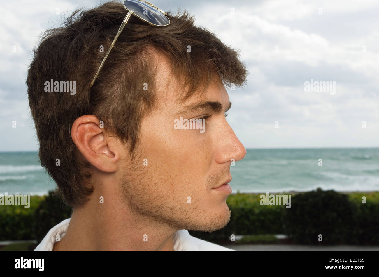 Close-up of a man with sunglasses on his head Stock Photo - Alamy