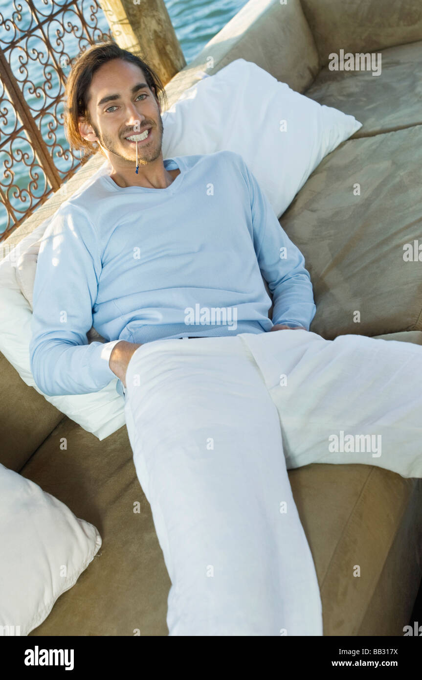Man resting in a tourist resort Stock Photo - Alamy
