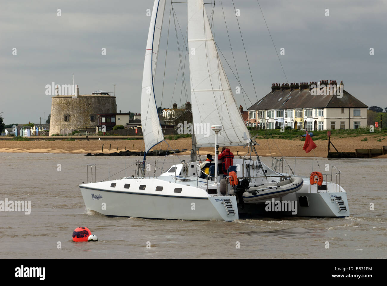 Catamaran sailing on the river Deben, Felixstowe Ferry, Suffolk, UK ...