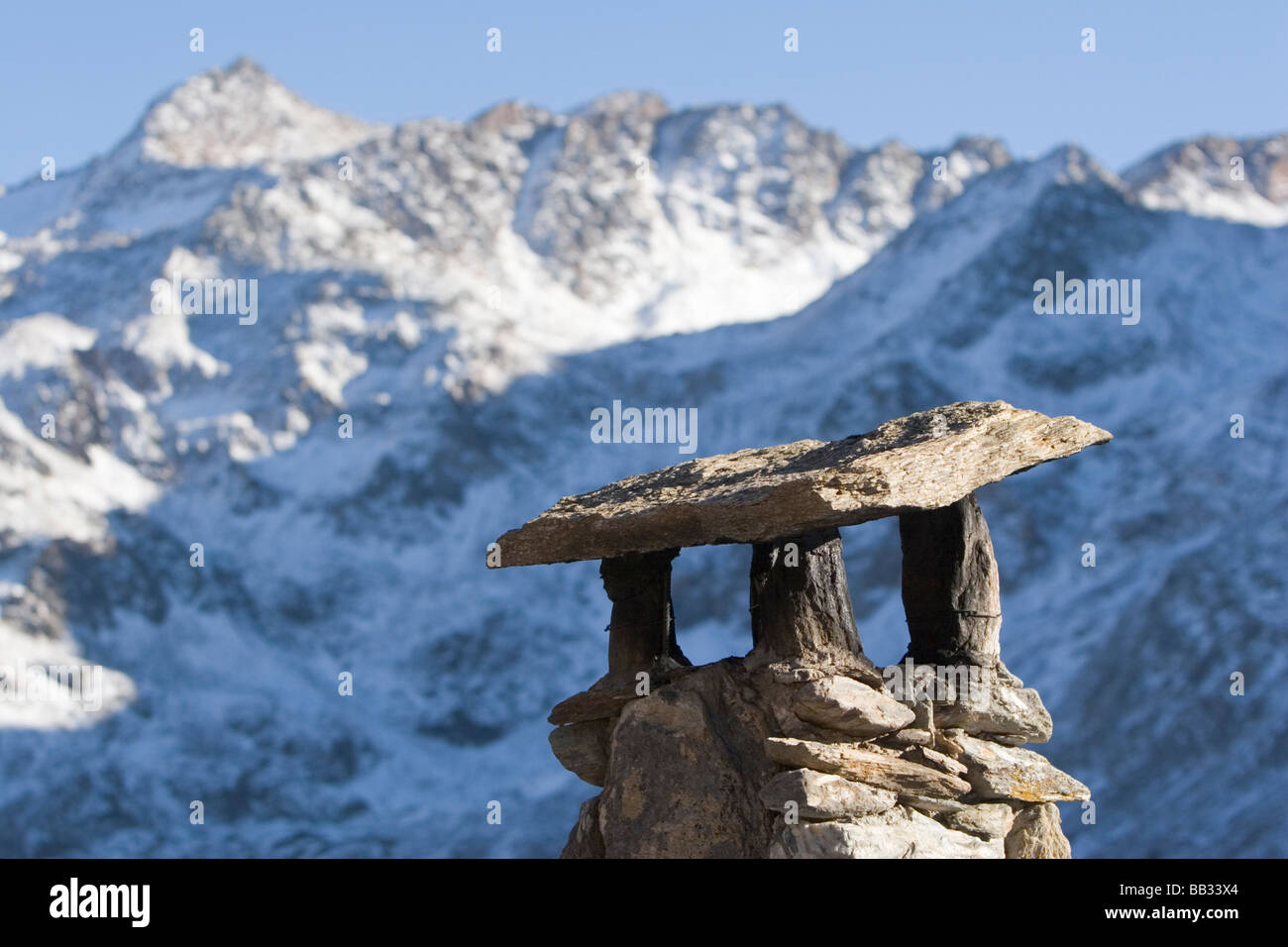 Traditional stone chimney on mountain hut in the Italian Alps. South ...