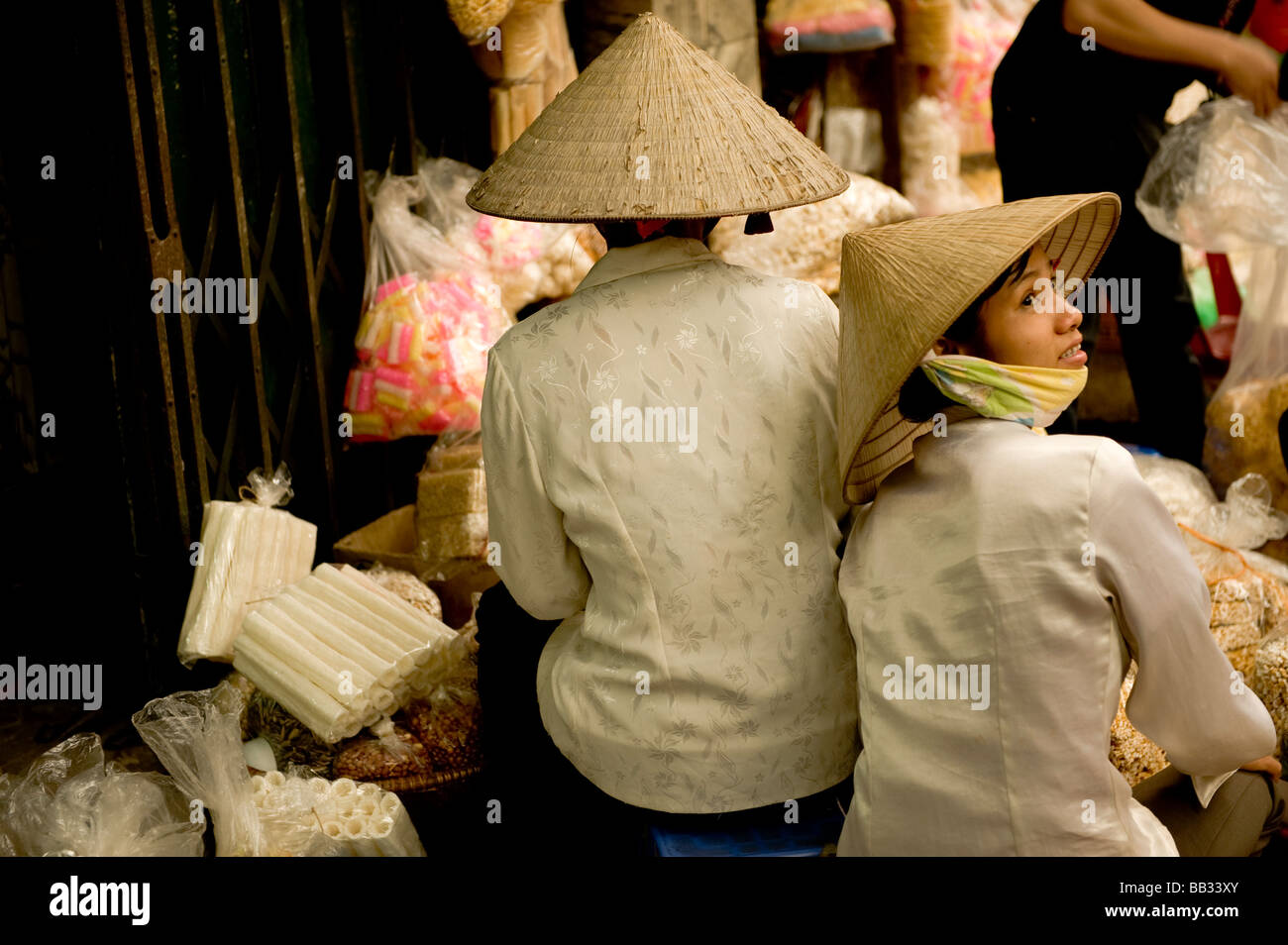 vietnamese ladies wearing traditional cone hat, old quarter, hanoi ...