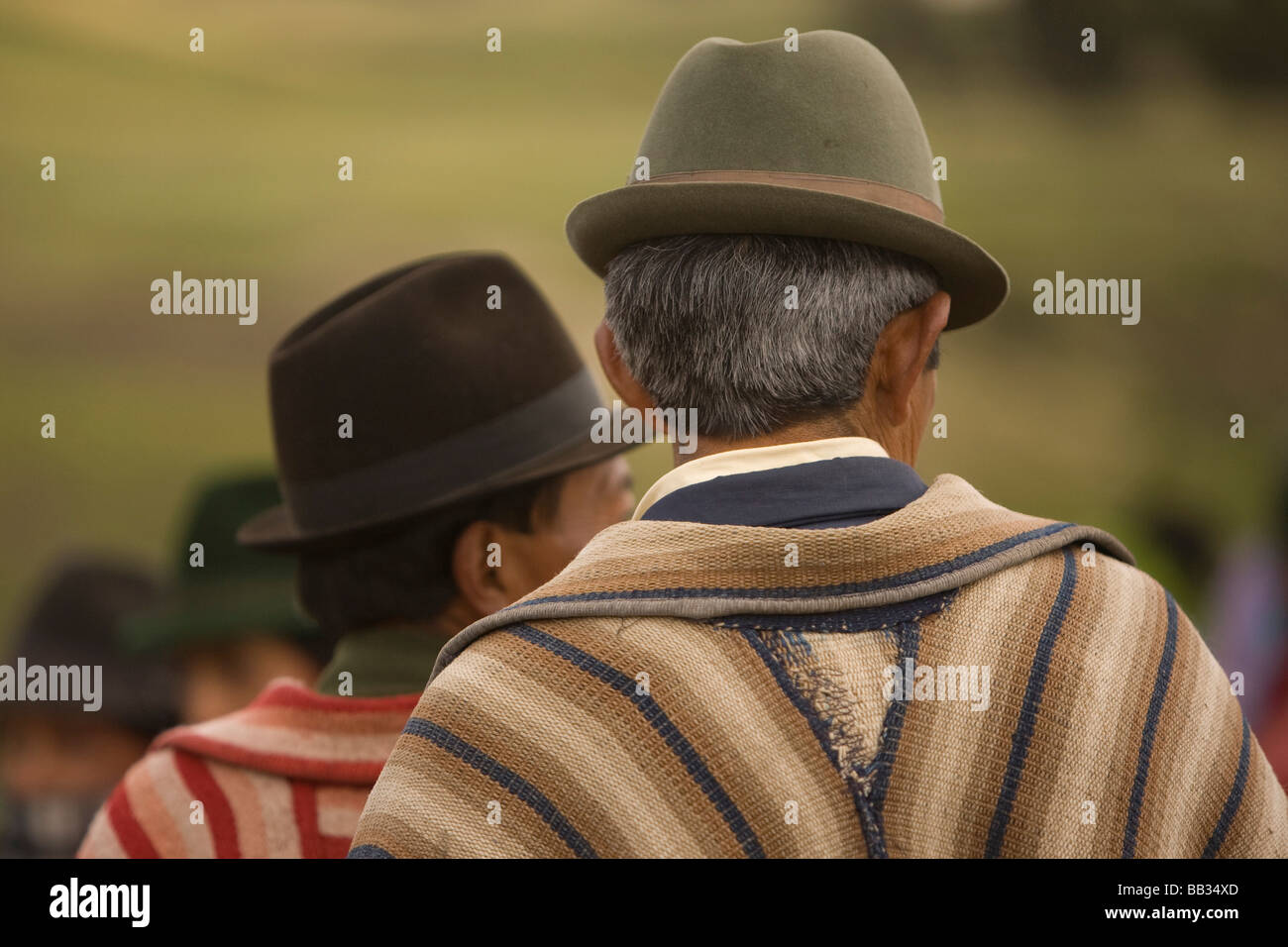 South America, Ecuador, men in traditional ponchos at weekly market ...