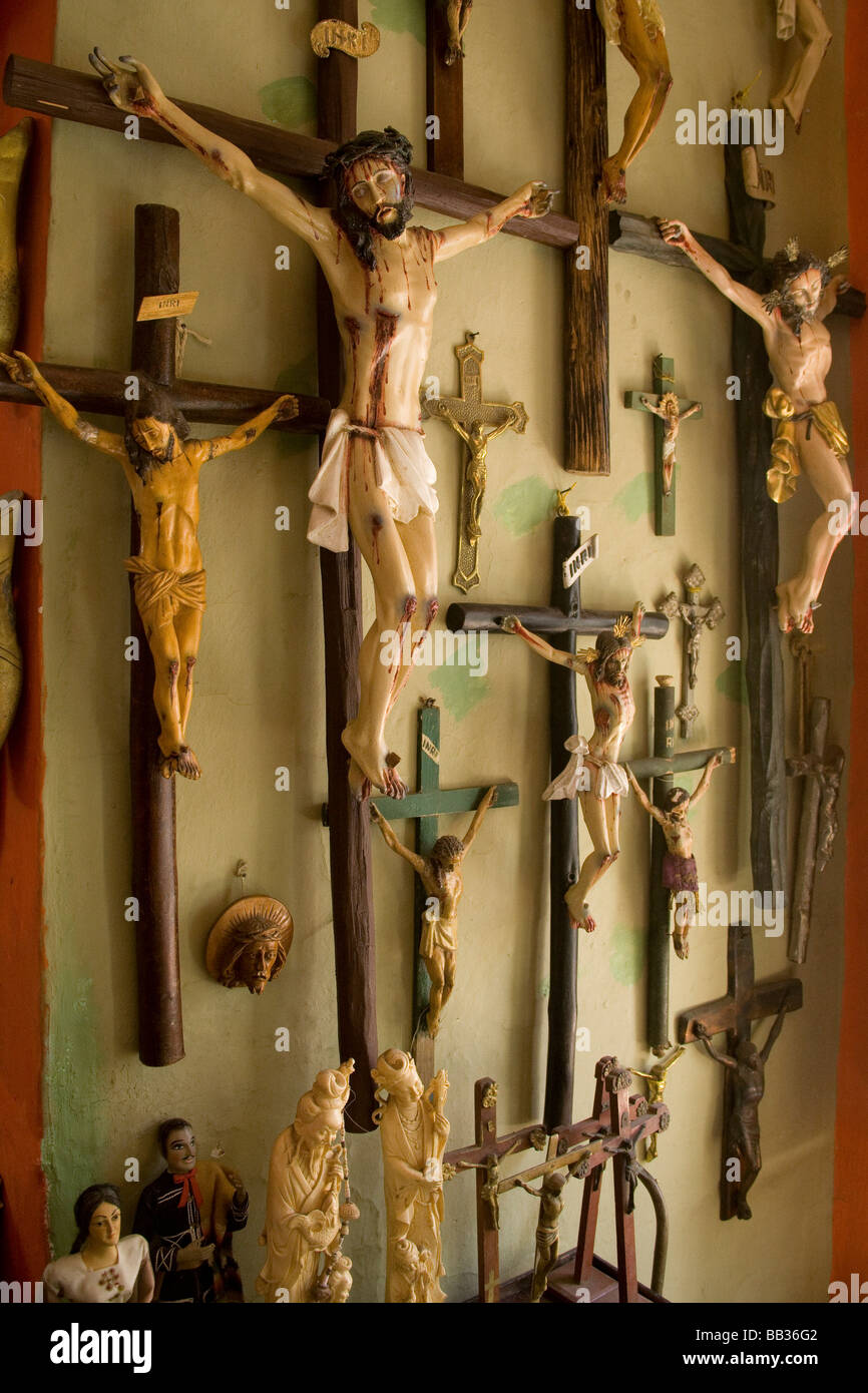Jesus Christ figurines on display in antique shop, Cuenca, Ecuador ...