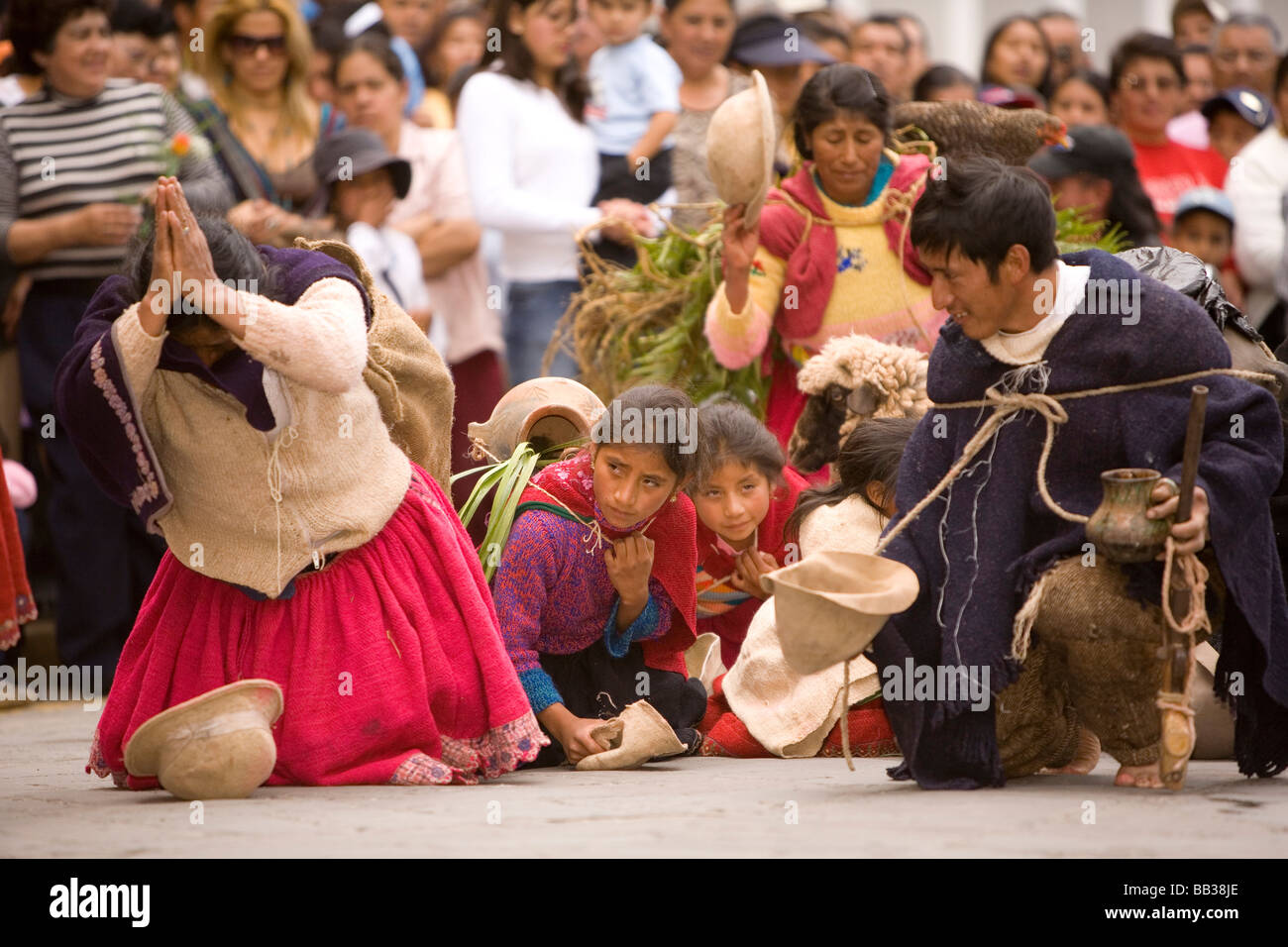 South America, Ecuador, Cuenca. Poor peasant family in annual parade ...