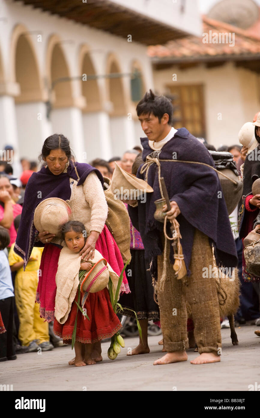 South America, Ecuador, Cuenca. Poor peasant family in annual parade ...