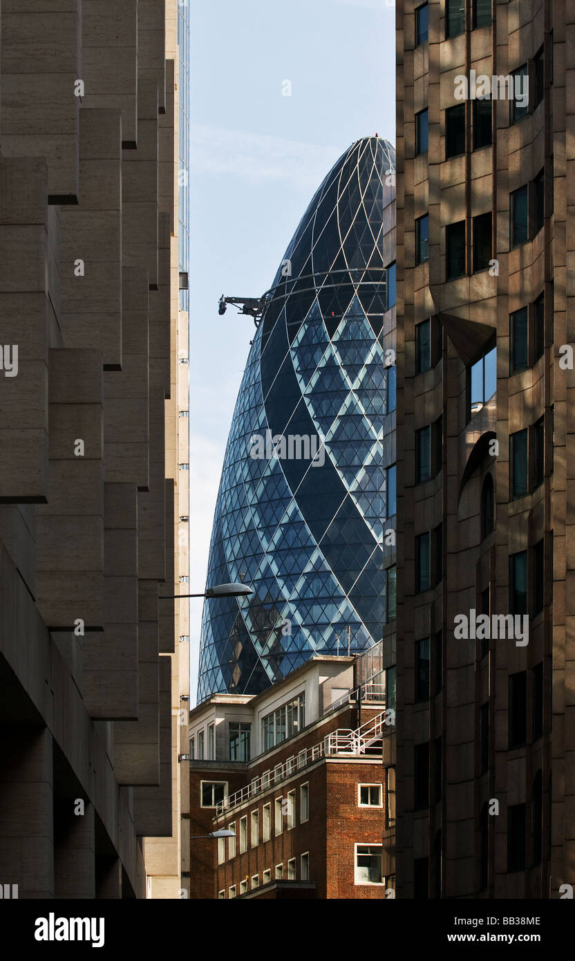 The Gherkin seen between two other buildings in London Stock Photo - Alamy