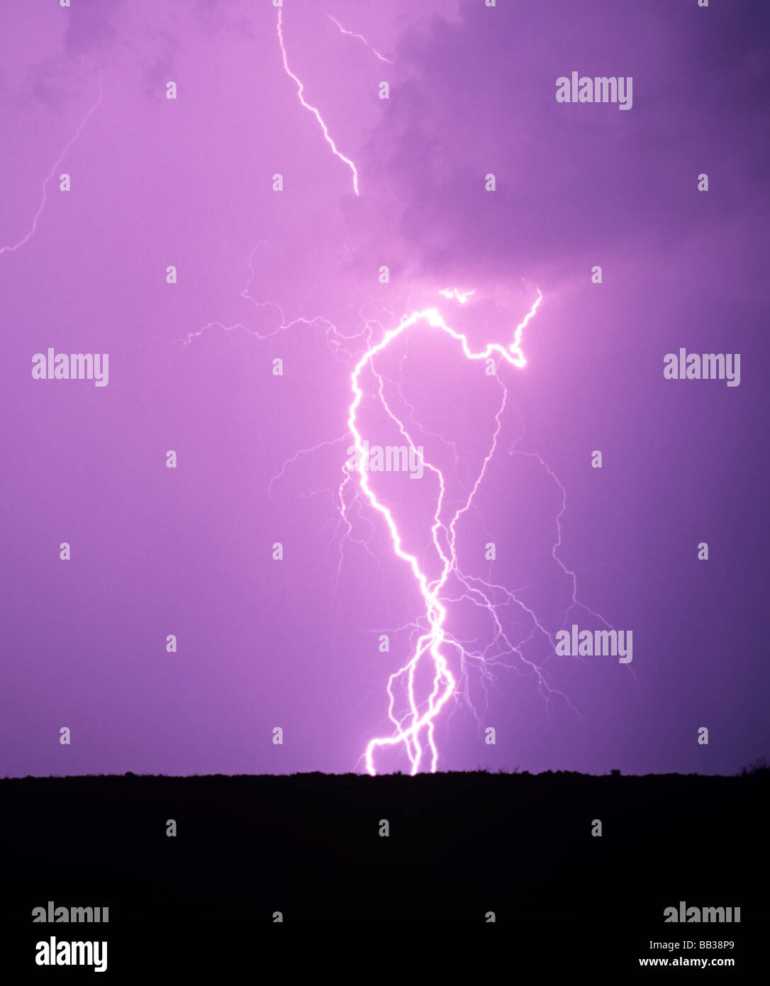 A lightning bolt hits the ground at at night. Lubbock, Texas, USA Stock ...