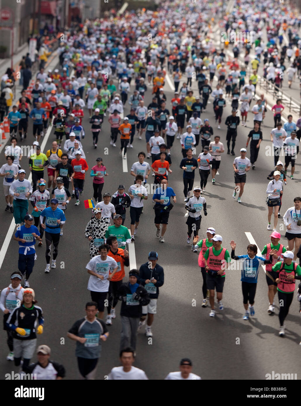 High angle shot of a large group of mainly asian runners during the ...