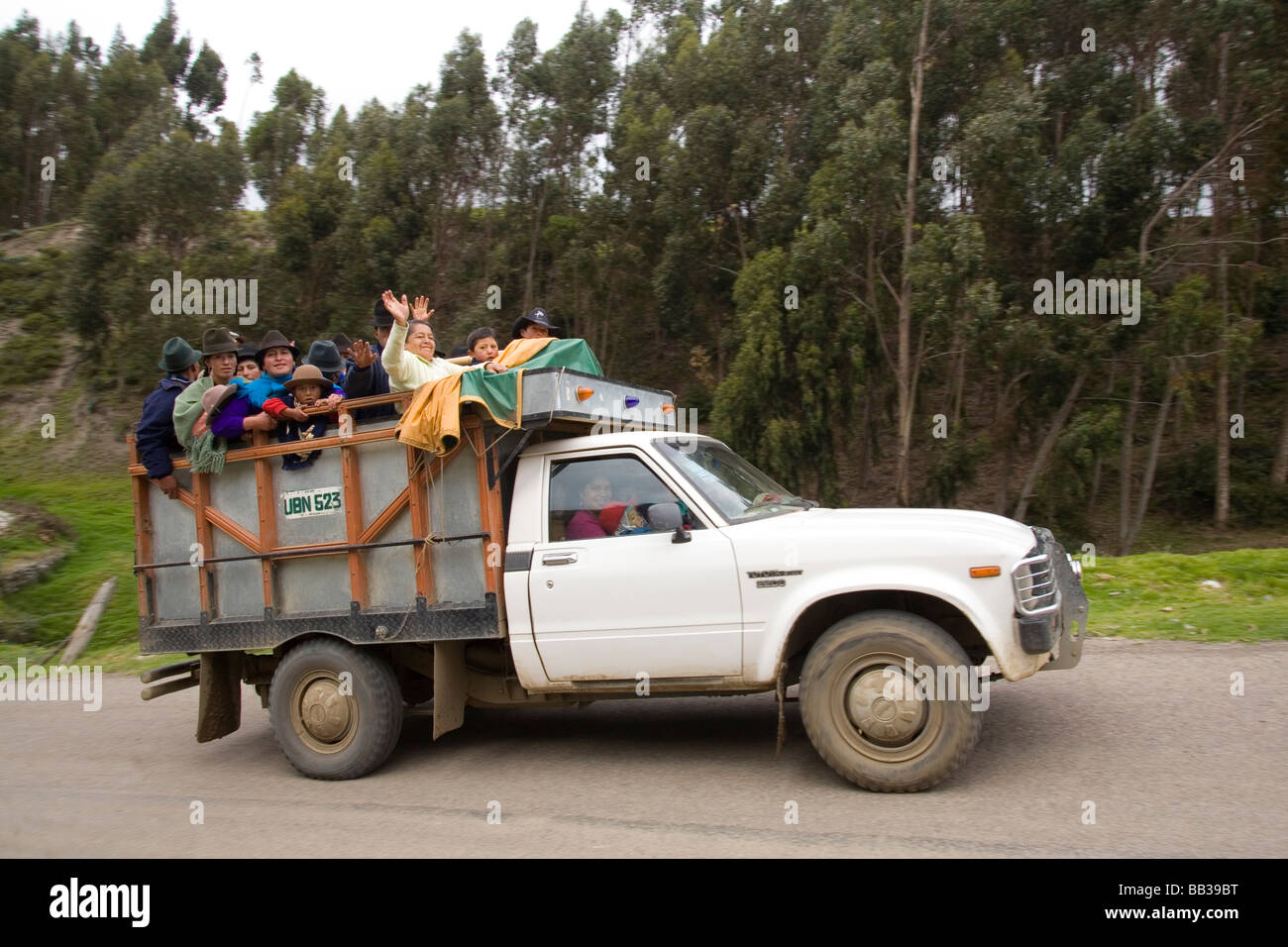 South America, Ecuador. Pick-up truck crowded with villagers on their ...