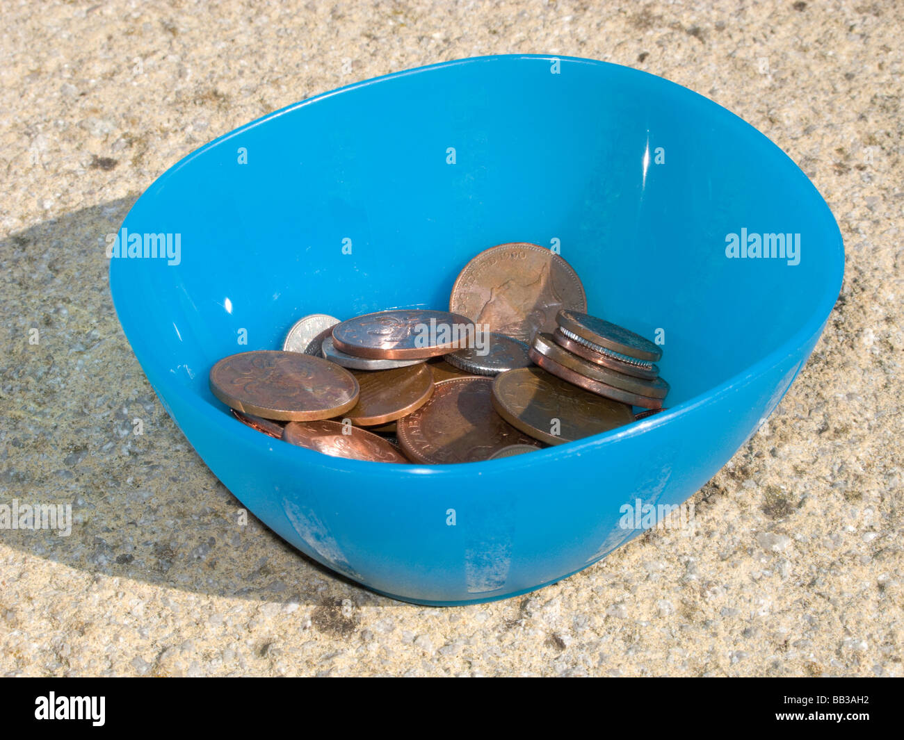 Begging bowl hi-res stock photography and images - Alamy
