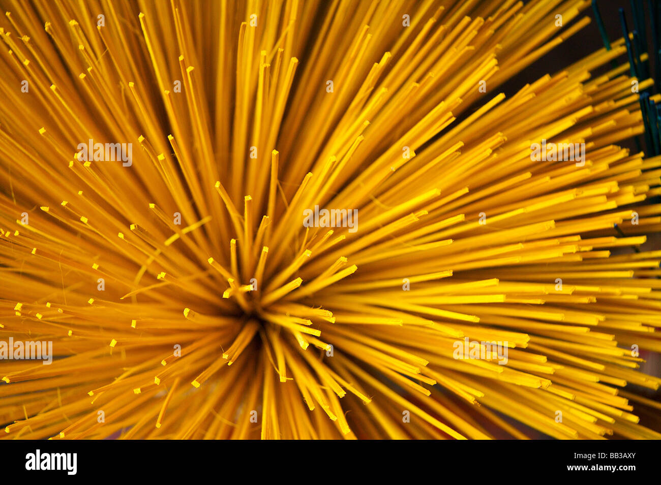 Starburst of yellow incense sticks Stock Photo - Alamy