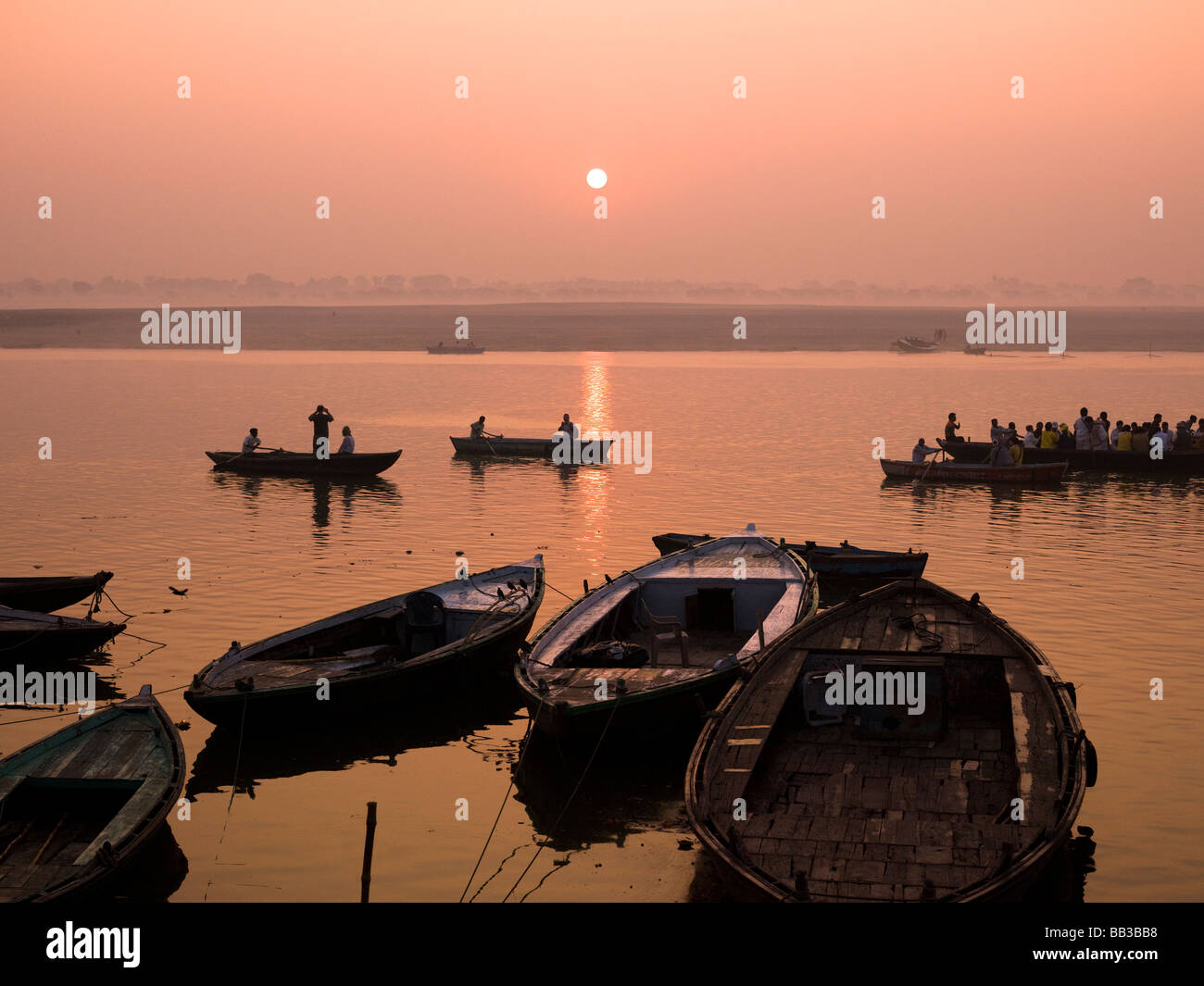 Boats on Ganges River at sunset; Varanasi, India Stock Photo - Alamy
