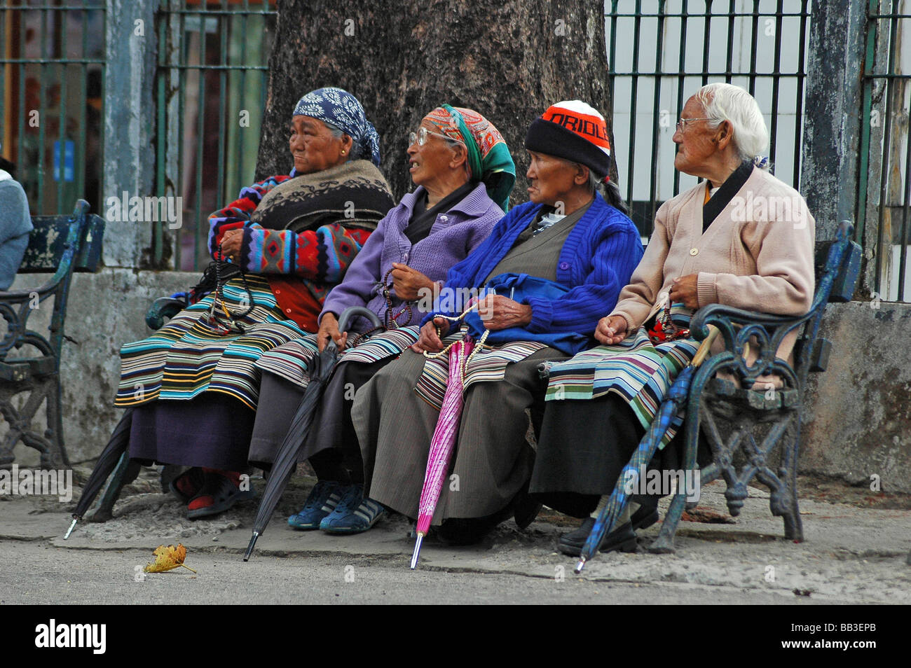 INDIA, Darjeeling. Group of old Nepali women sitting on a bench ...
