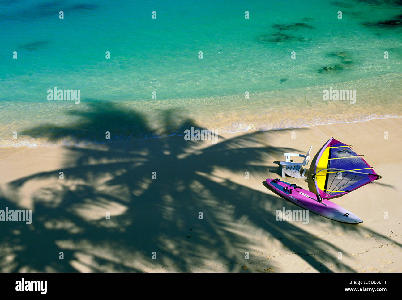 USA, Hawaii. Chair and windsurfer on beach Stock Photo - Alamy