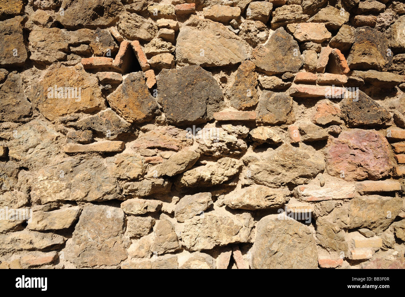Ancient stone wall in Barcelona, Spain Stock Photo - Alamy