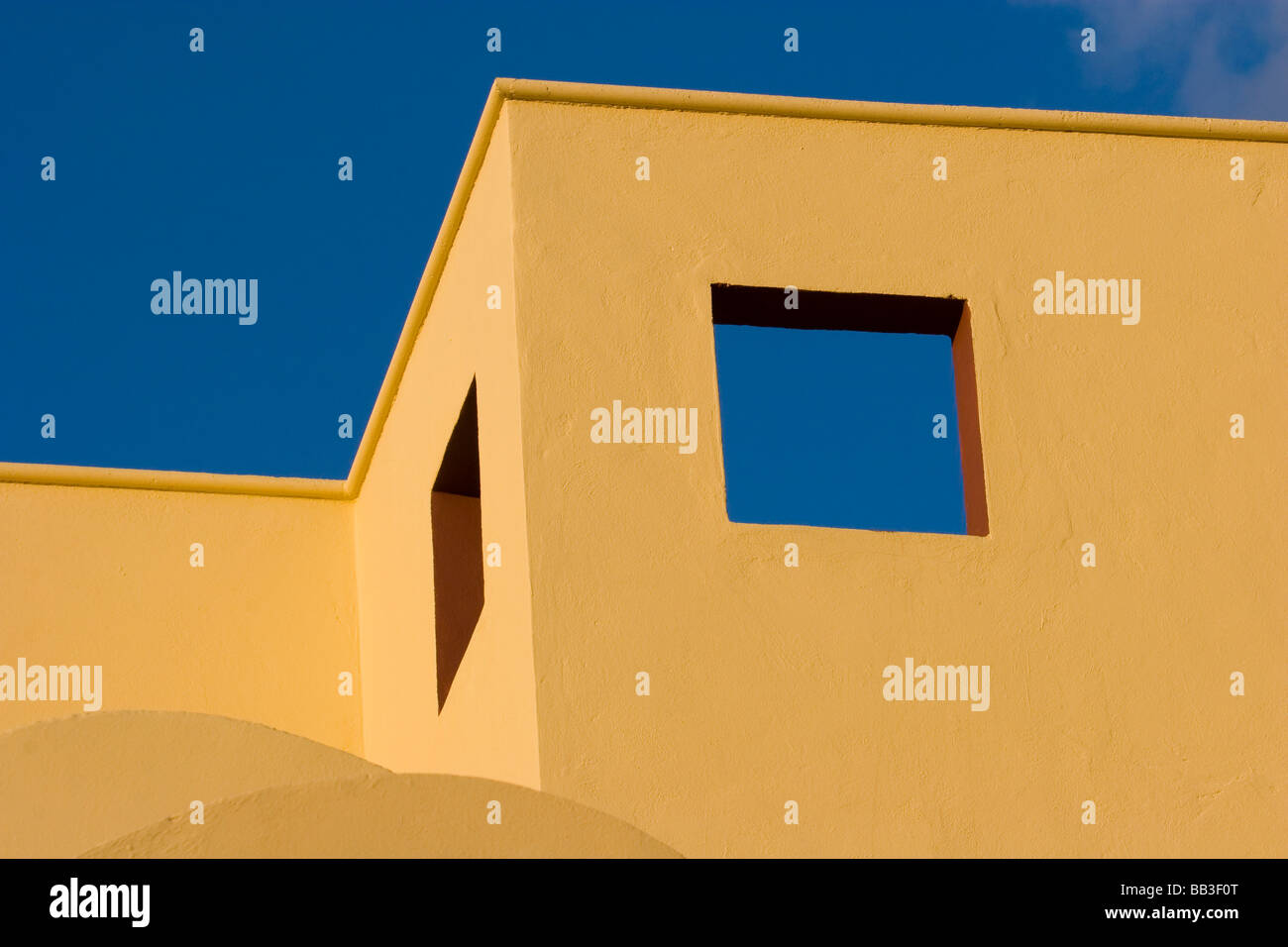 Mexico, San Miguel de Allende. Angled roofline of yellow building ...