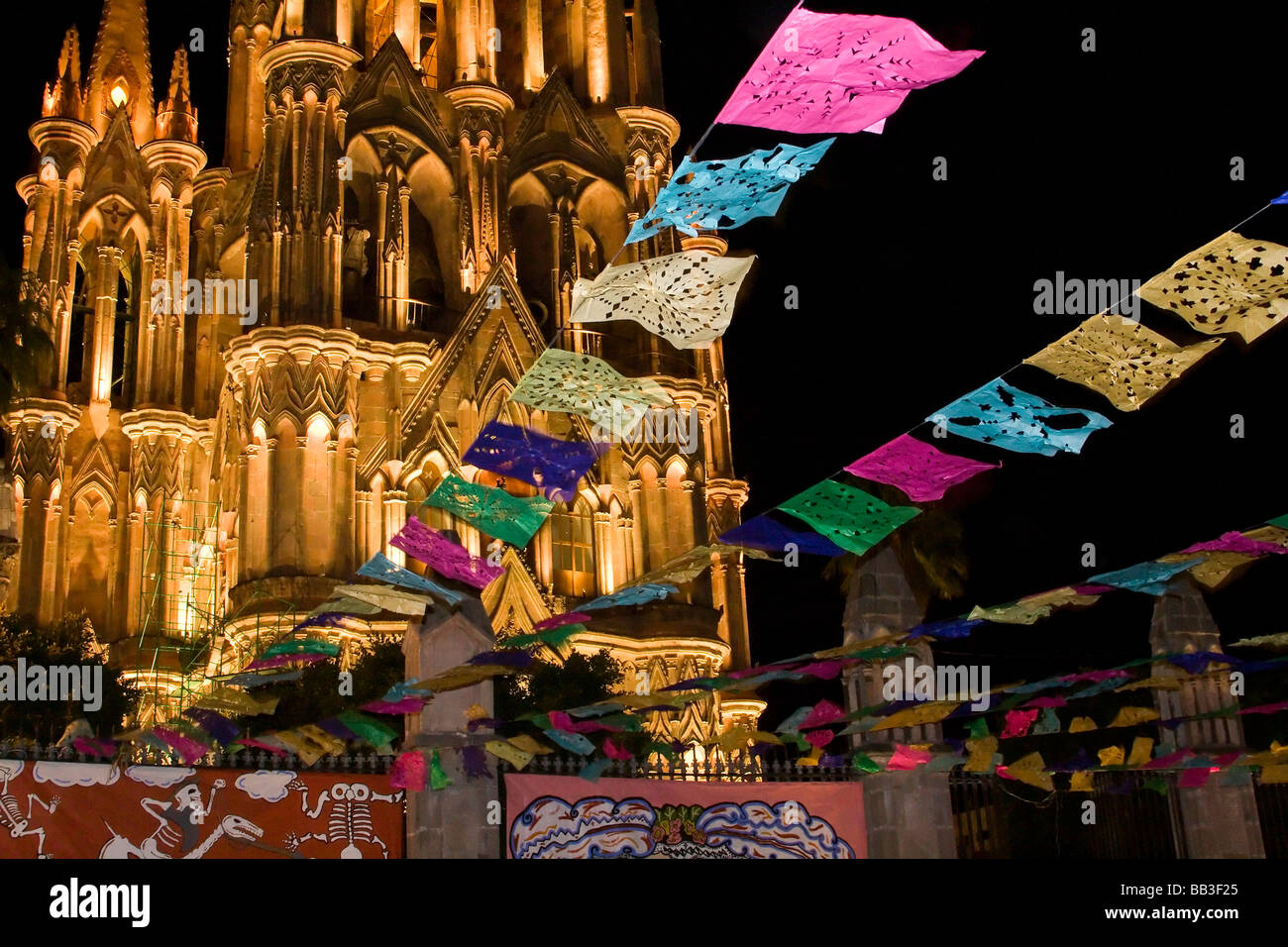 Mexico, San Miguel de Allende. Festival banners fly at night in front ...