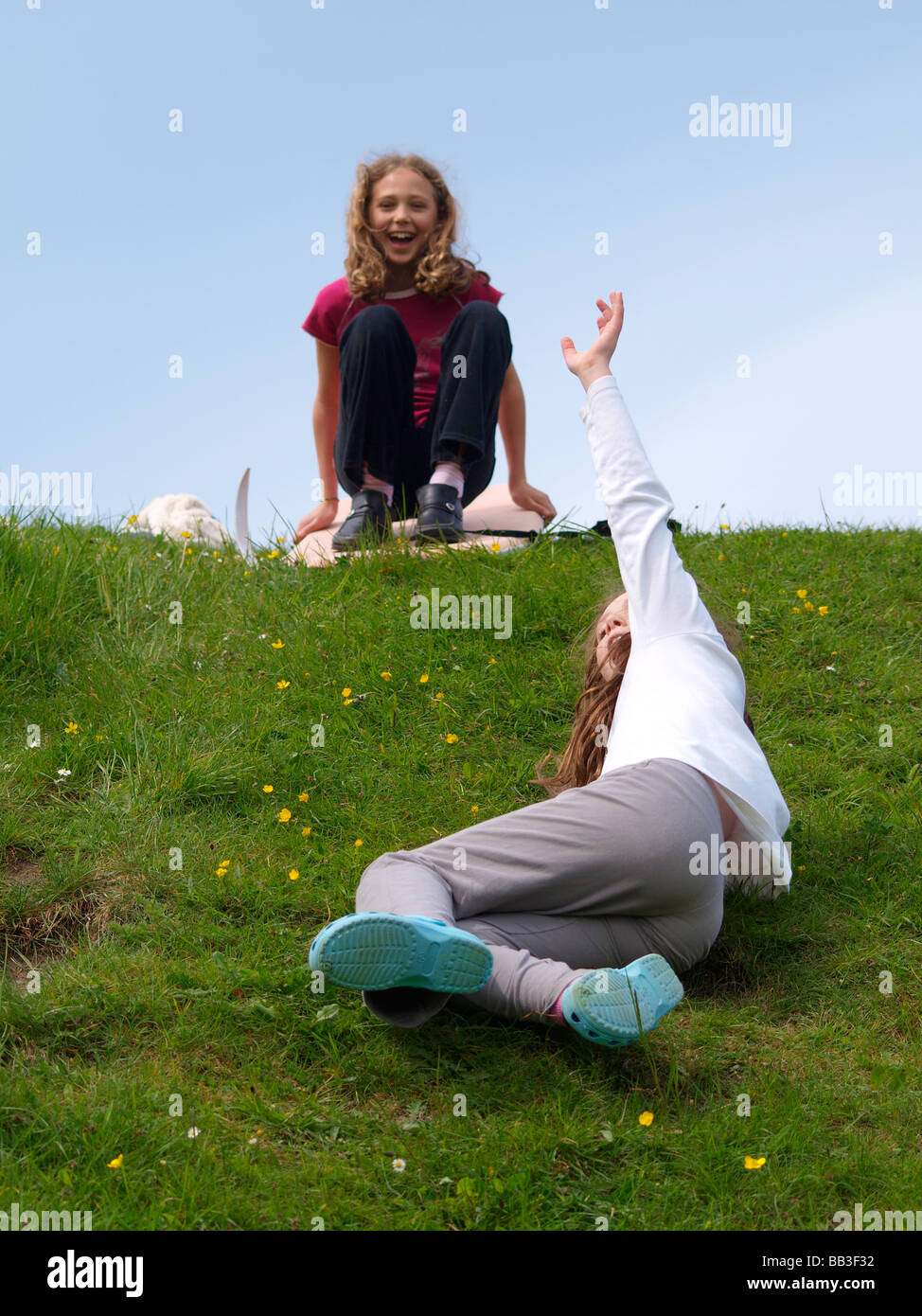 Girls Kids Sliding High Resolution Stock Photography and Images - Alamy