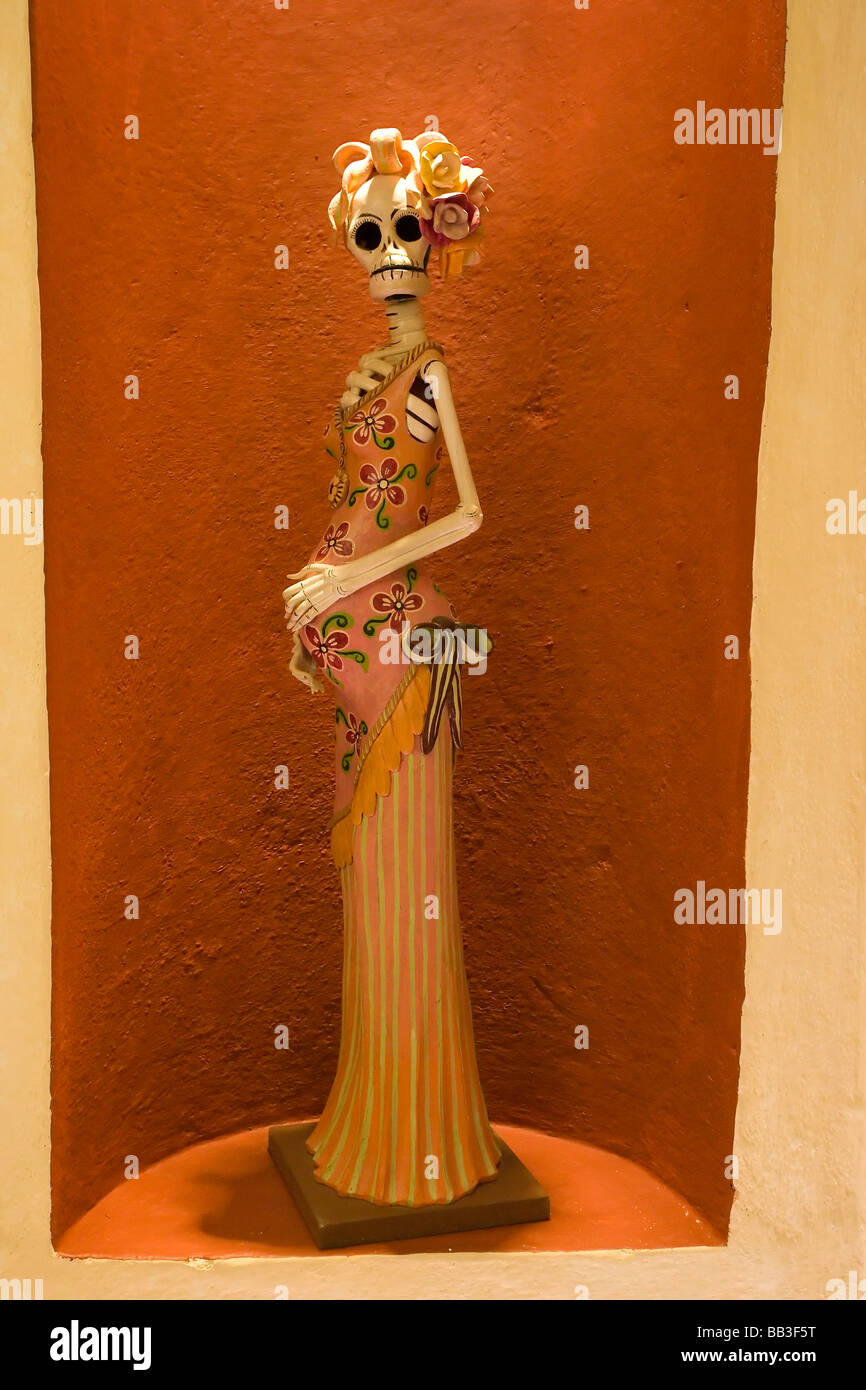 Mexico, San Miguel de Allende. Small statue of female skeleton dressed ...