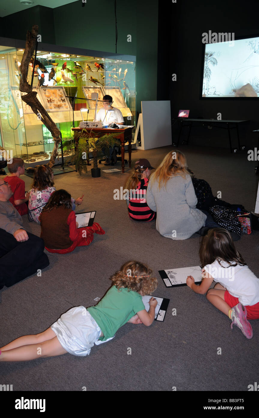Children and families enjoying an educational lecture inside Melbourne ...