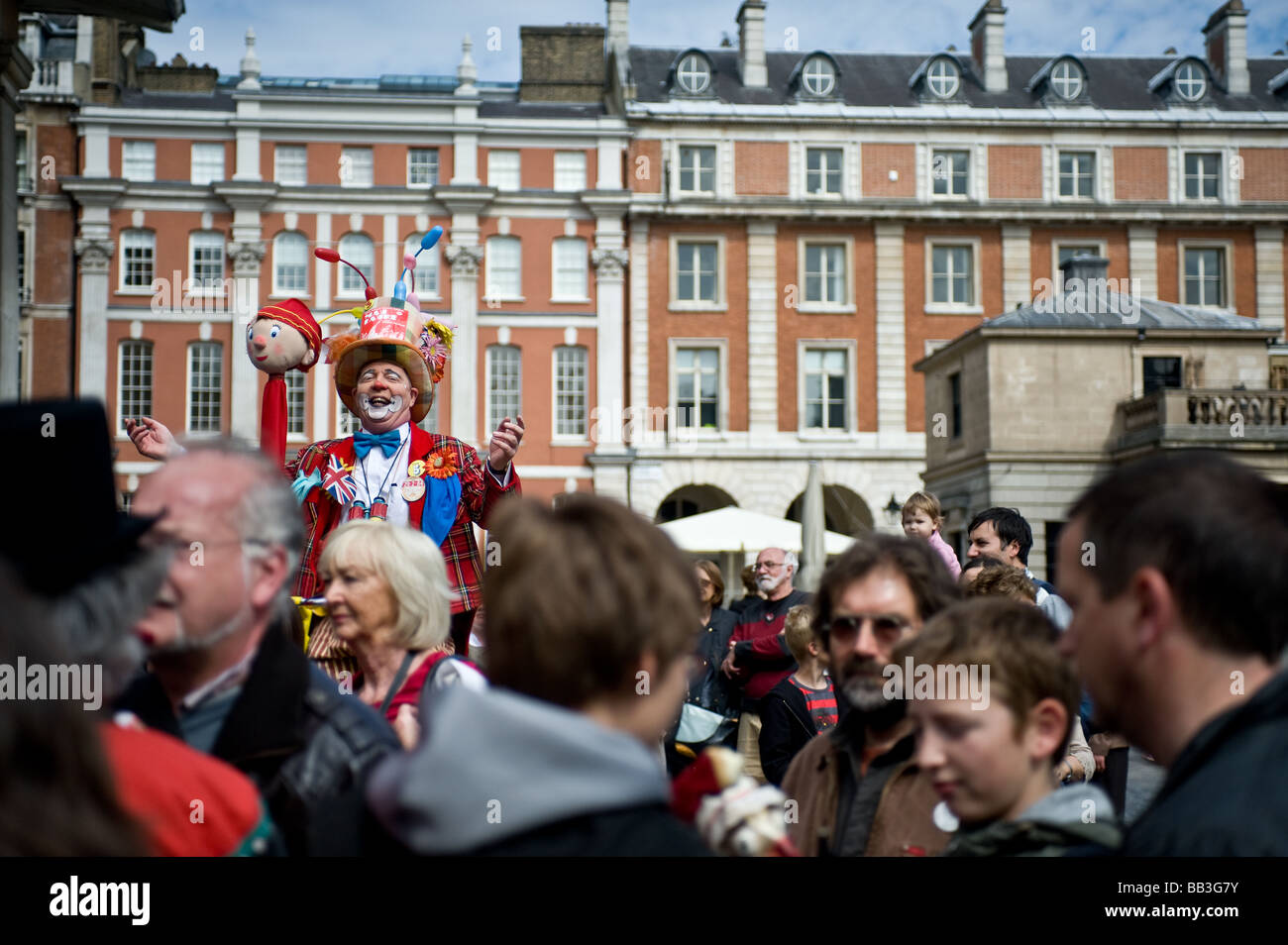 Professor Crump standing on stilts above the crowd in Covent Garden ...