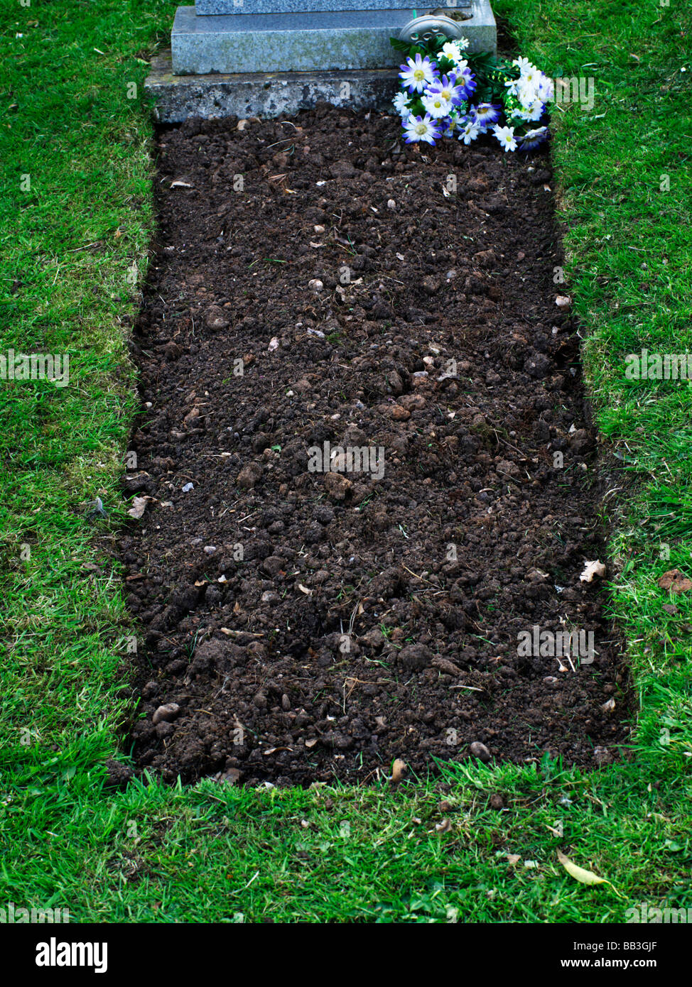 gravestones lit by the sun in a country cemetery Stock Photo - Alamy