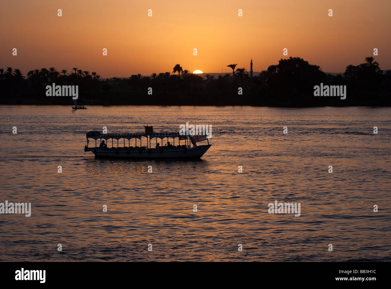 Small Tourist Boat on the Nile at Luxor at Sunset Stock Photo - Alamy