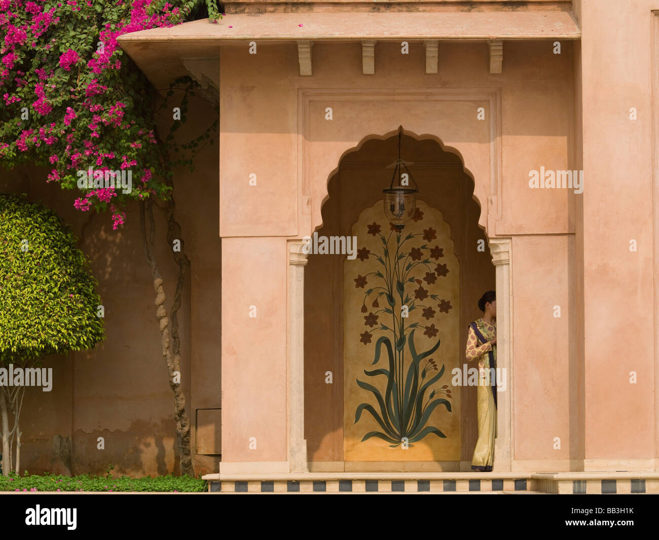 Young woman standing behind column; Agra, India Stock Photo - Alamy