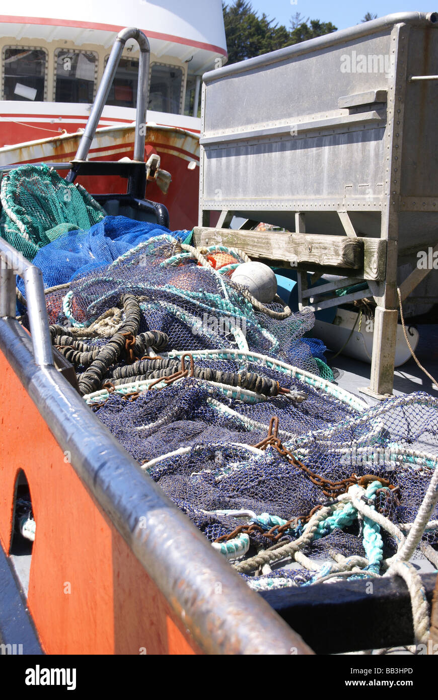 Aft section of orange fshing boat with ropes and lines on deck Newport ...
