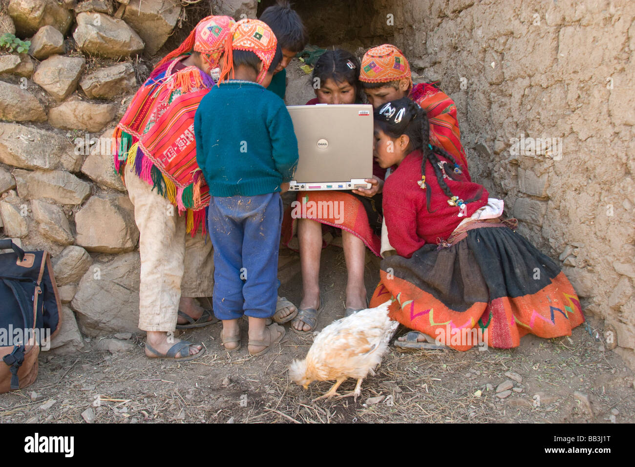 Peruvian children looking at laptop, Ollantayambo, Peru Stock Photo - Alamy