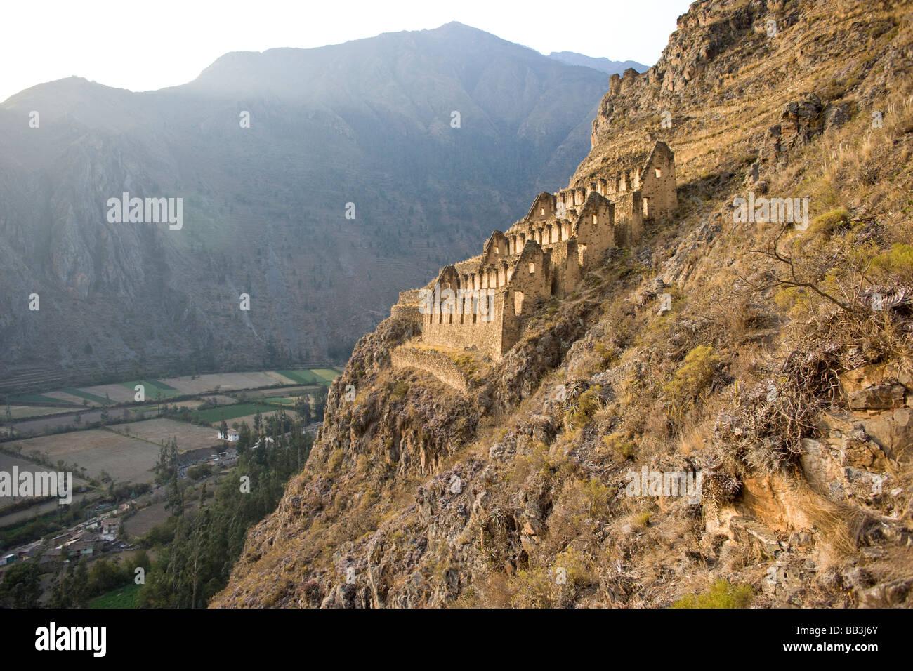 Aztec granary with town below, Ollantayambo, Peru Stock Photo - Alamy