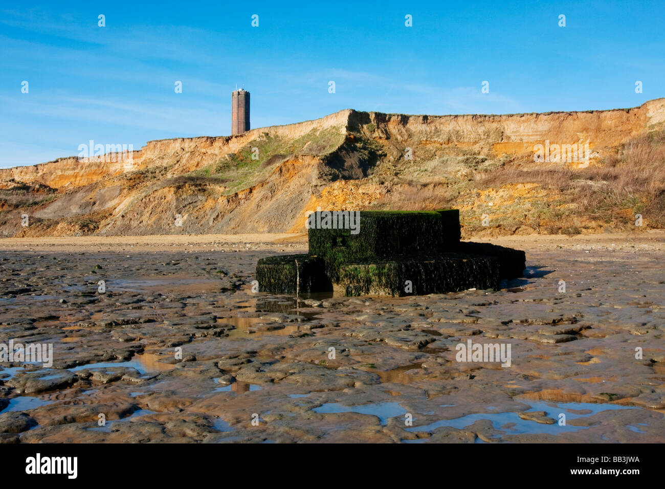 The eroded cliffs and the Naze tower on the Essex Coast along with a ...
