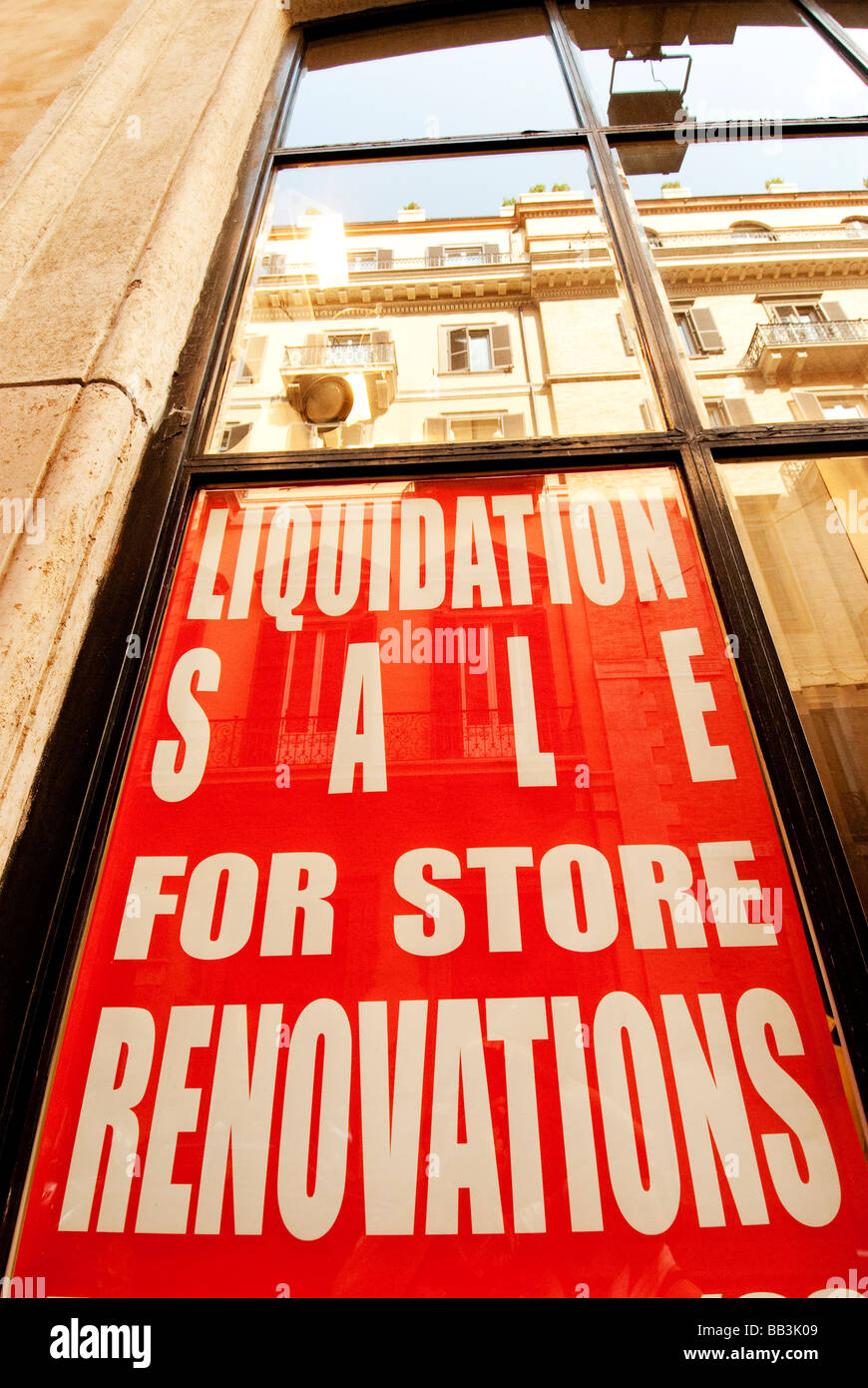 liquidation sale sign in a shop window Stock Photo - Alamy