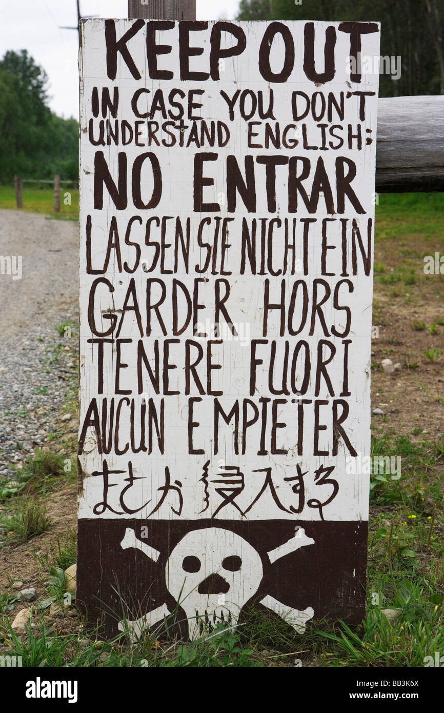 USA, Alaska, Wasilla. Warning sign in different languages Stock Photo ...