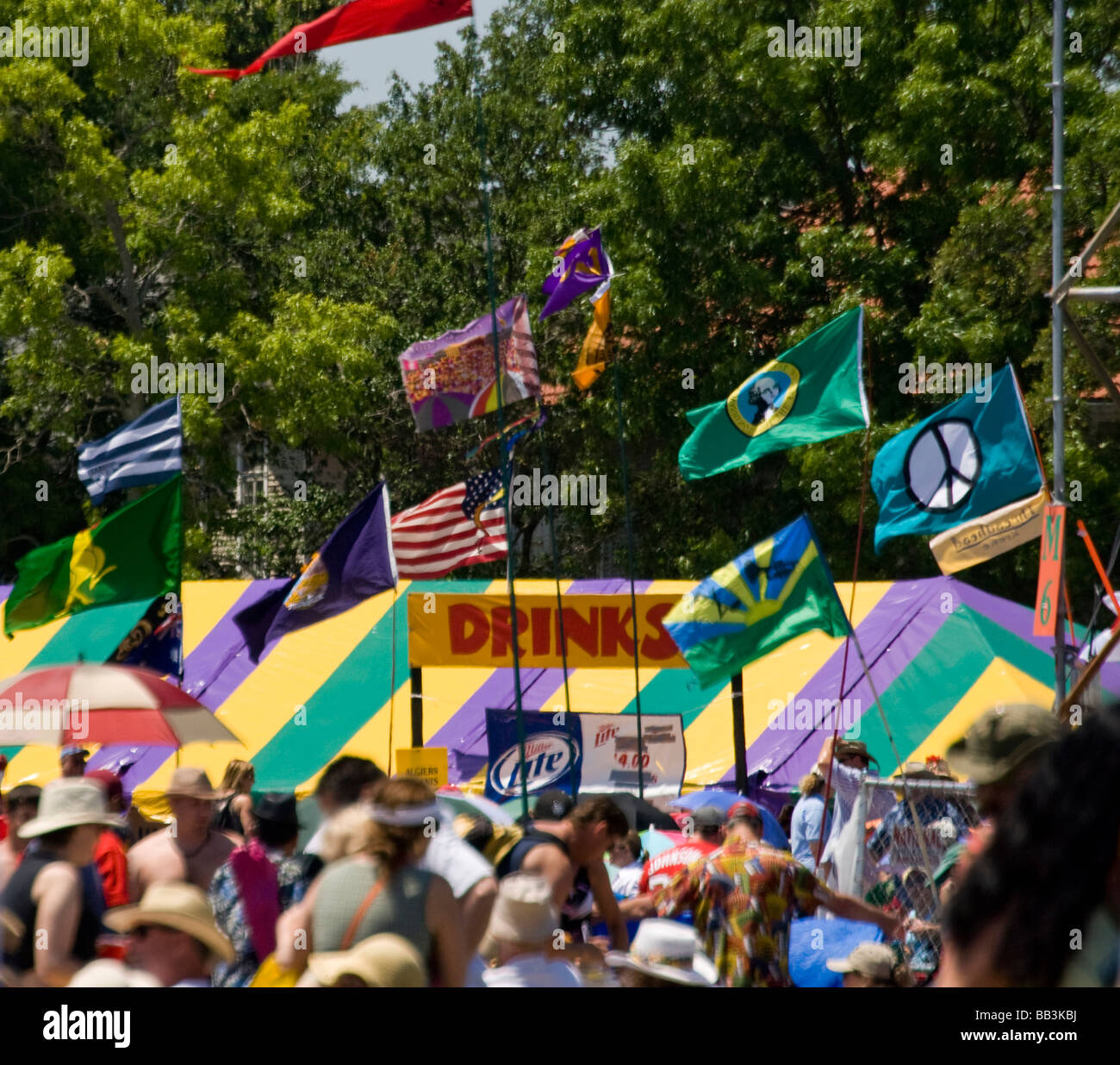 USA, Louisiana, New Orleans. Colorful flags and crowd of people at the ...