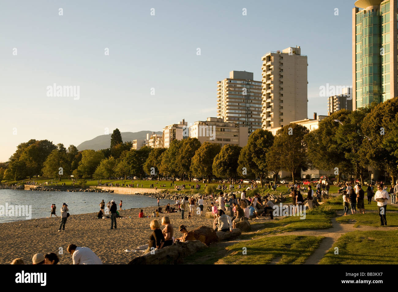 Enjoying the beach and waiting for sunset at English Bay Beach in the ...